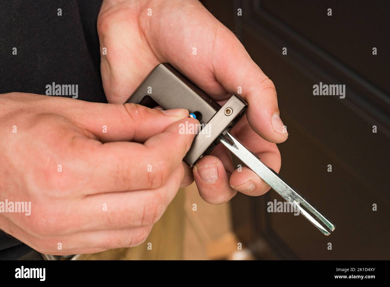 Handyman holding a doorknob and hex key, doorknob installation, metal ...