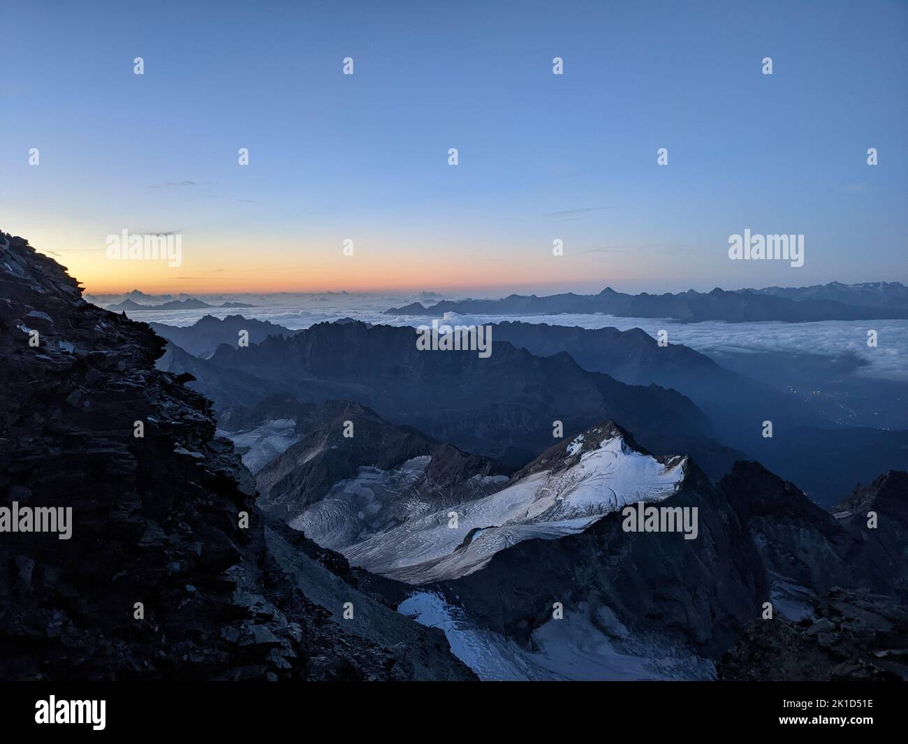 Mountaineering at sunrise. Wonderful view of the Alps with the first ...