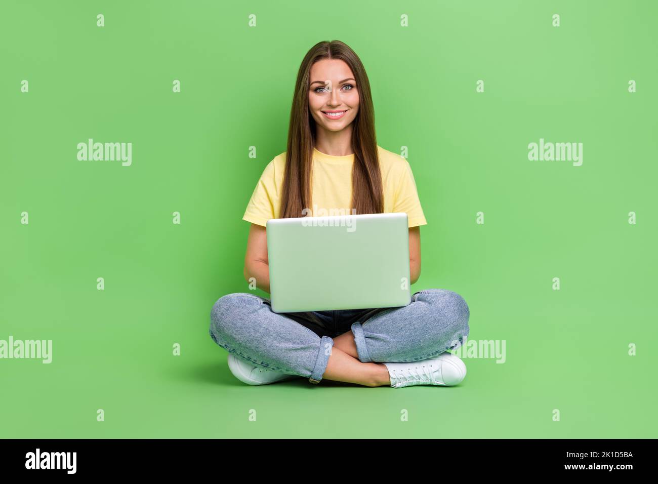 Photo of pretty adorable lady sit floor sit floor use device gadget ...