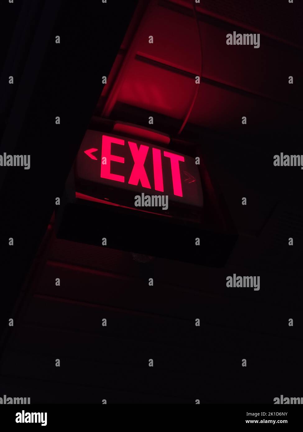 An illuminated Exit sign with red light Stock Photo - Alamy