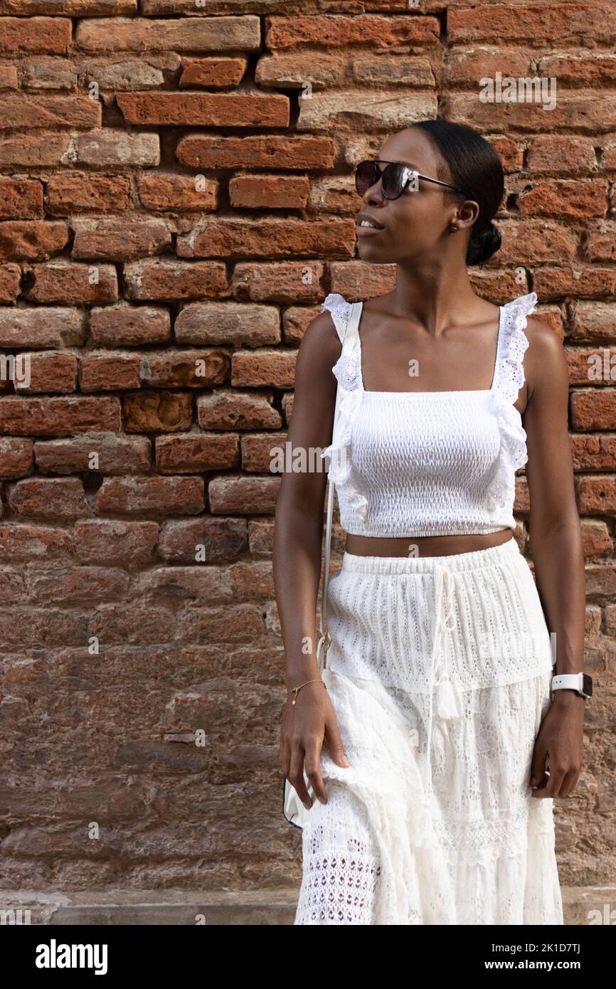 Portrait of turist woman dressed in white getting to know Europe ...
