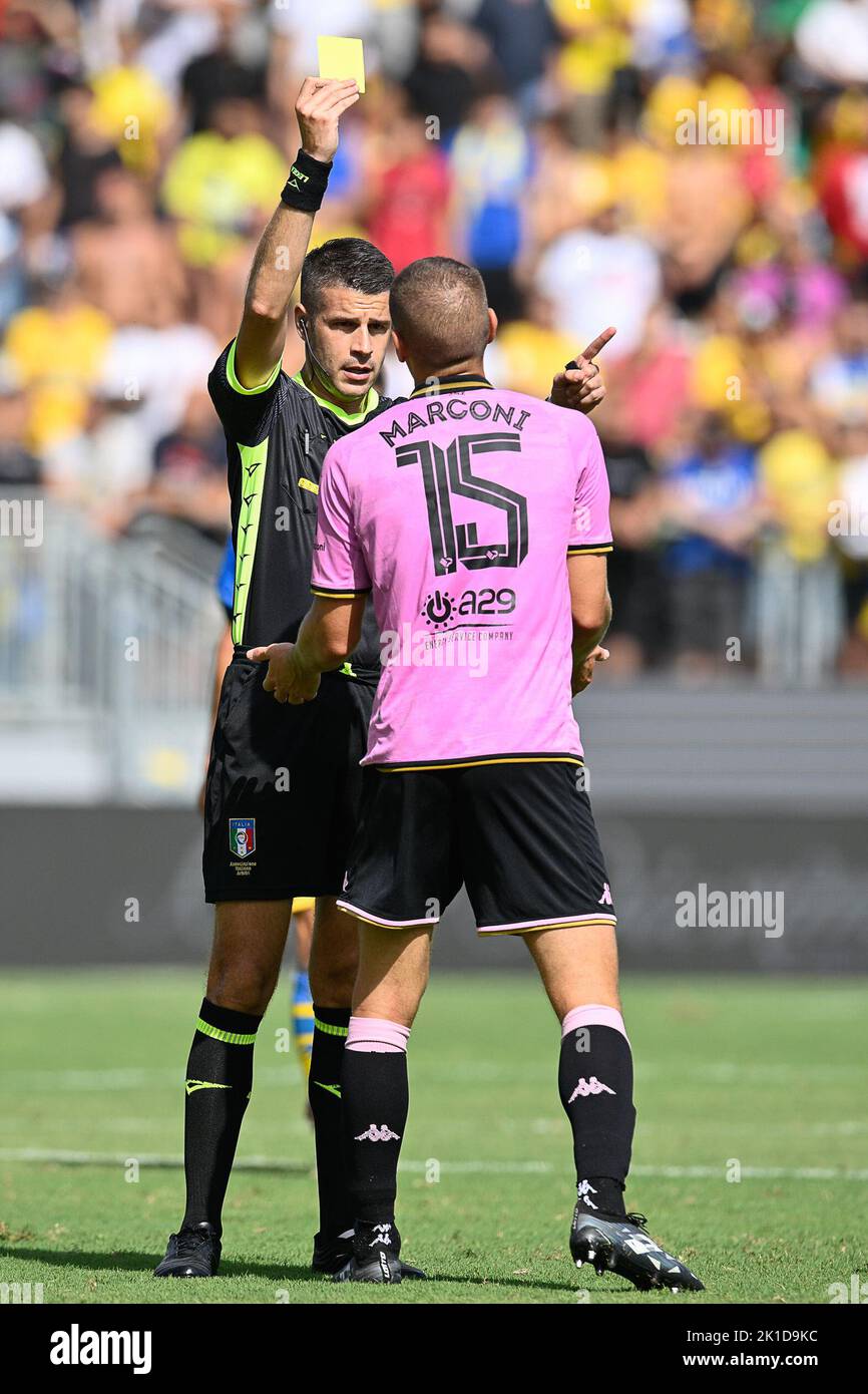 Referee Antonio Giua shows the yellow card to Ivan Marconi of Palermo ...