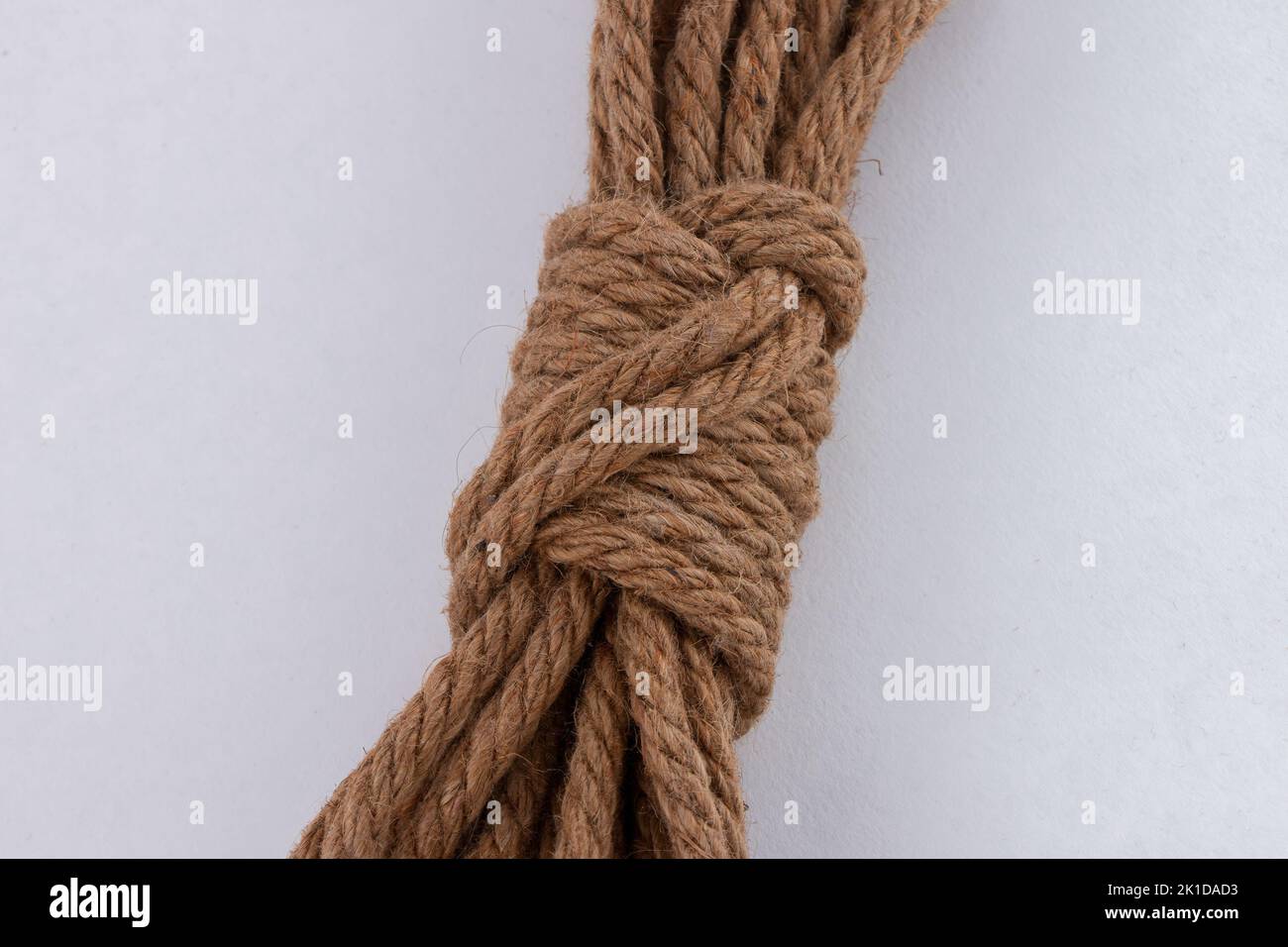 A closeup of an 8mm jute rope coil isolated on a white background Stock ...