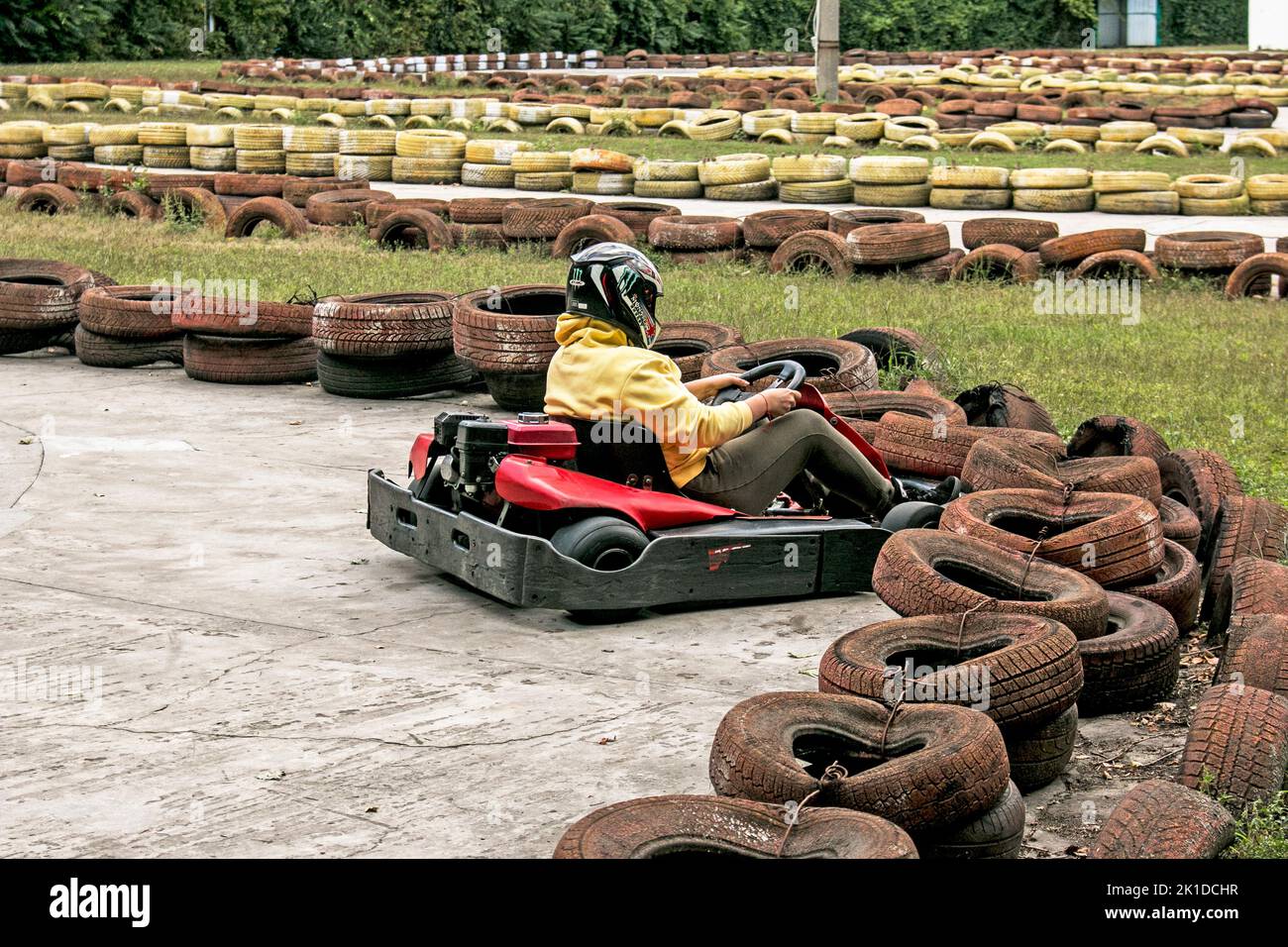 Karting. Go Kart on the track. Young positive racers driving a kart ...