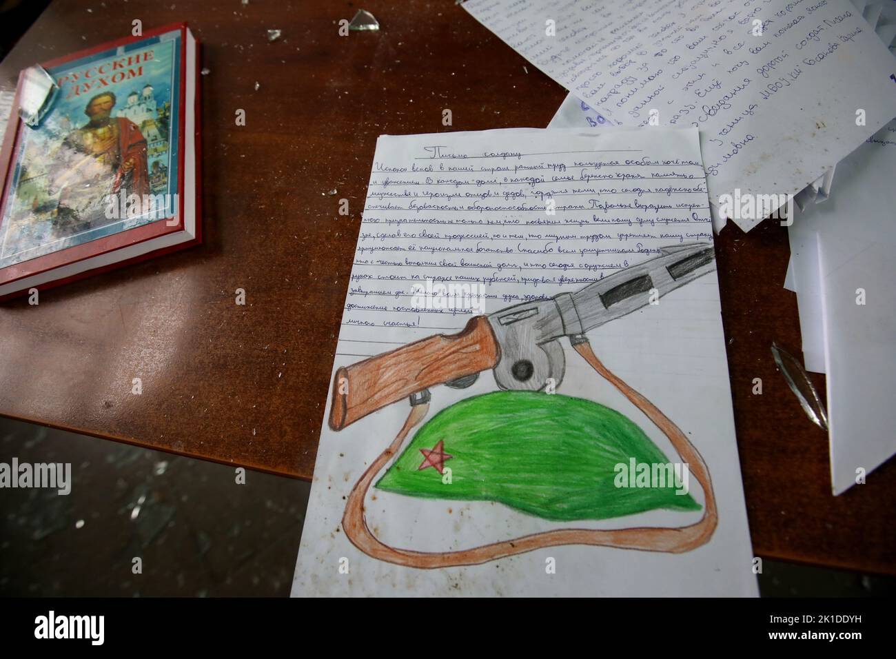 KOZACHA LOPAN, UKRAINE - SEPTEMBER 16, 2022 - A book and letters lie on ...