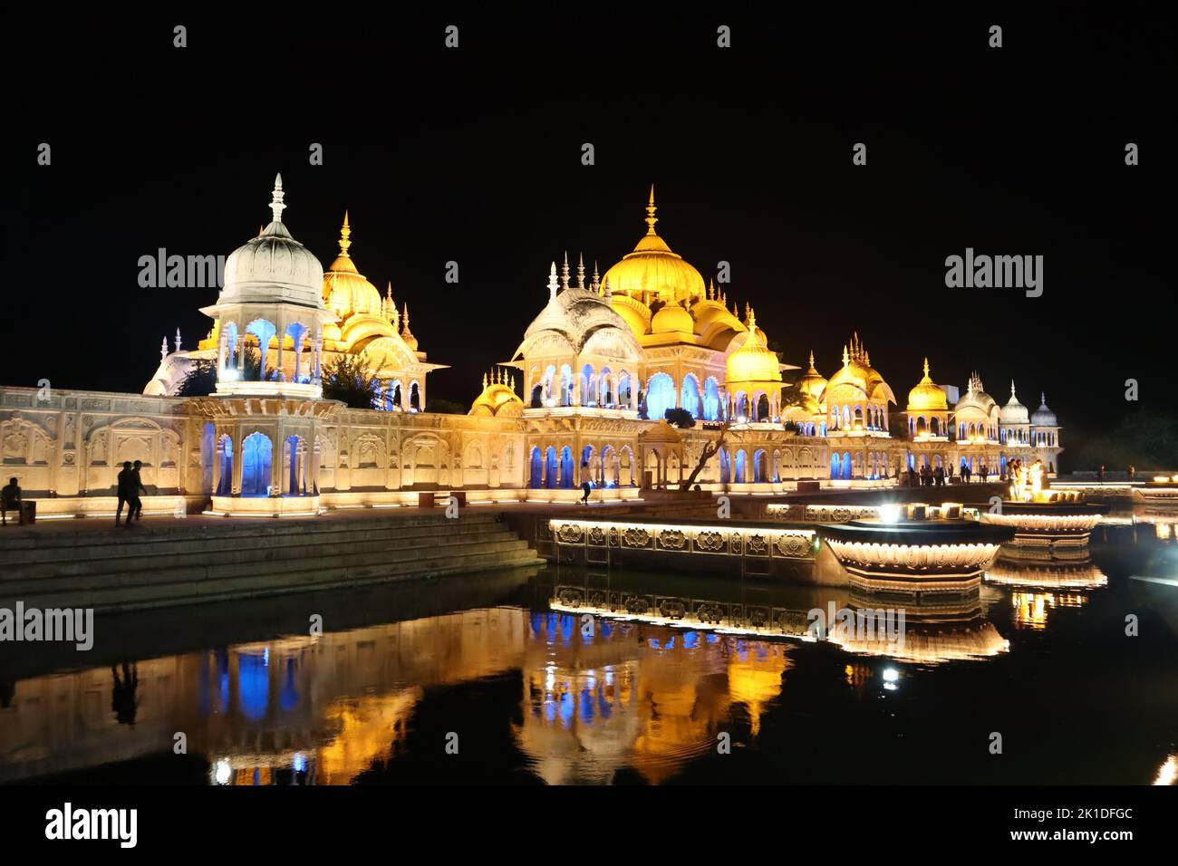 A night scene of a sacred water reservoir Kusum Sarovar, in Mathura ...