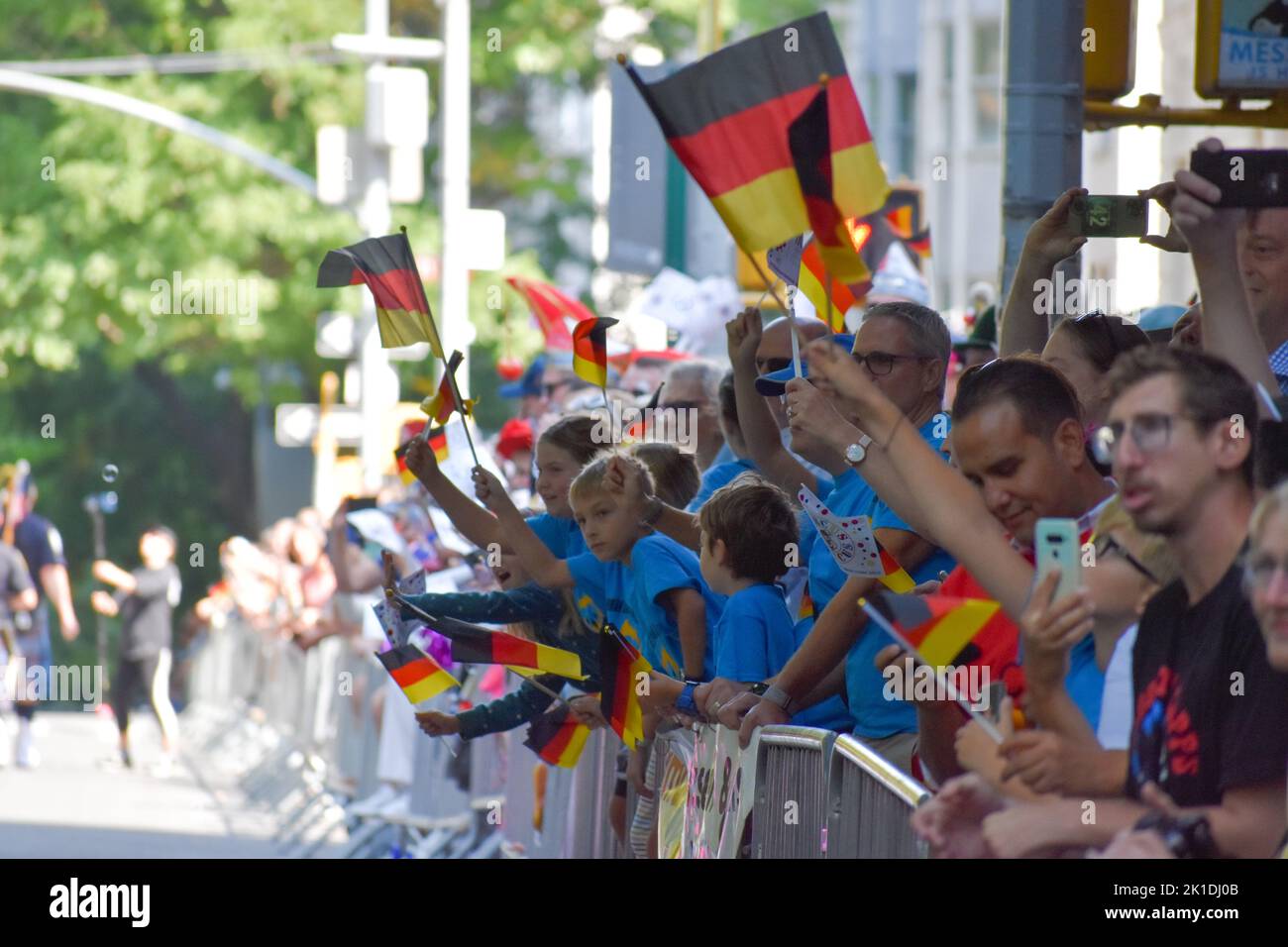 Spectators with German flags are seen on Fifth Ave in New York City ...