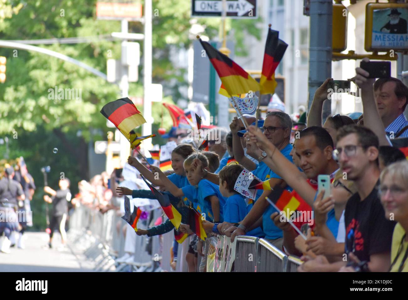 Spectators with German flags are seen on Fifth Ave in New York City ...