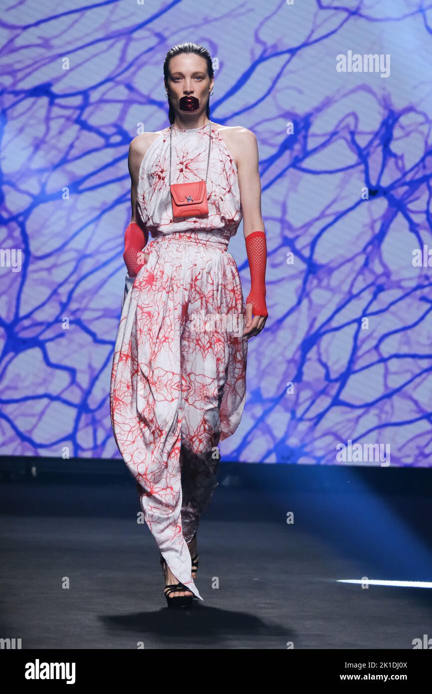 Madrid, Spain. 17th Sep, 2022. A model walks the runway wearing a ...