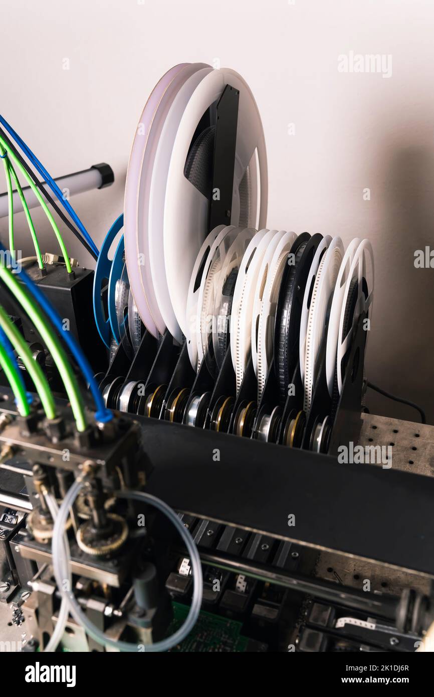 Various rolls of tape with electrical components to be mounted onto PCB ...