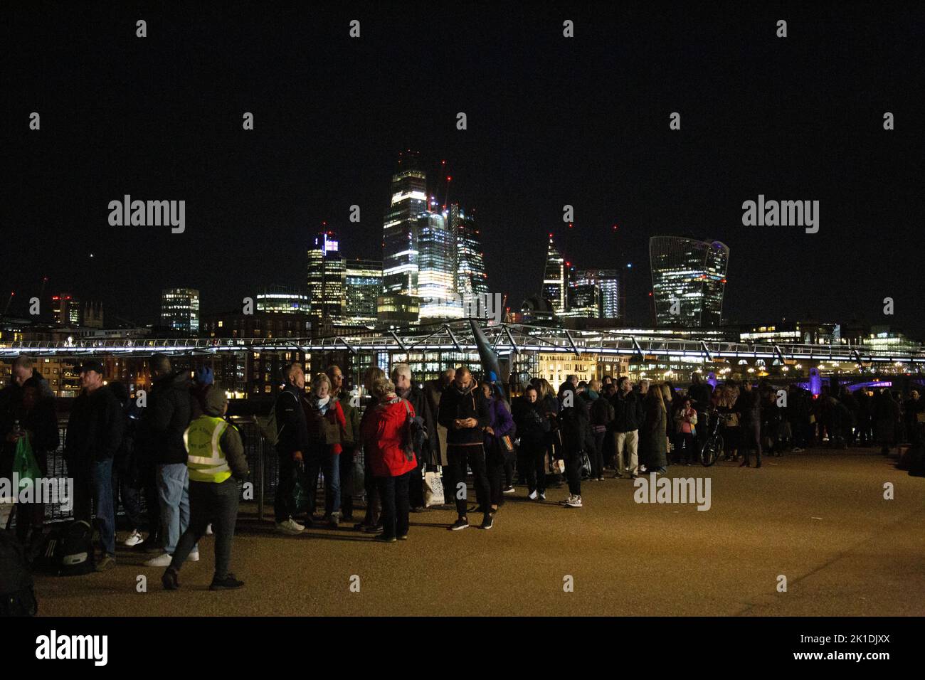 The Queue to see Queen Elizabeth lying in state at night with the city ...
