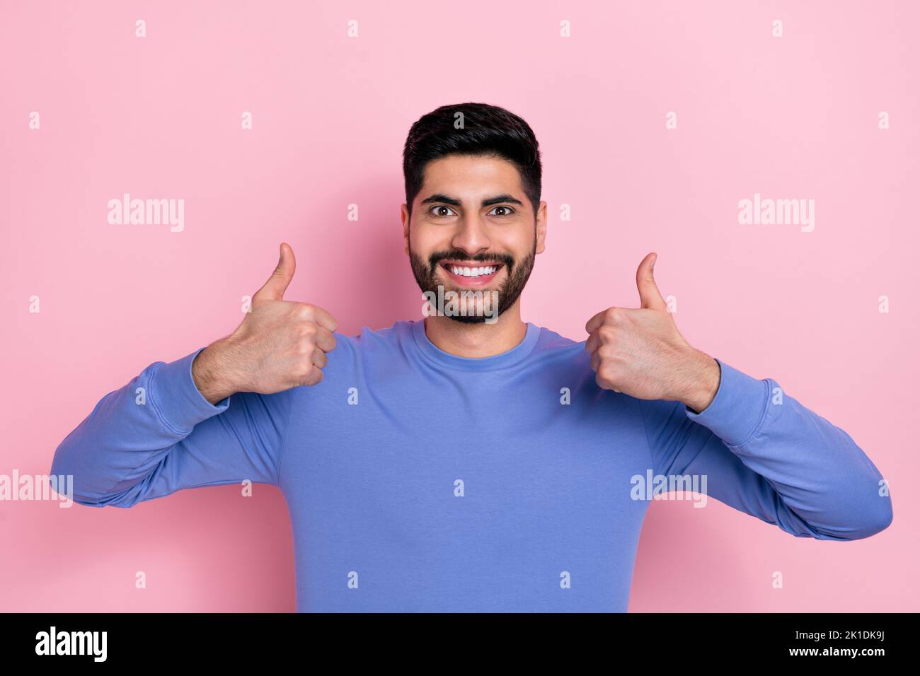 Photo of pretty confident arab guy dressed blue pullover showing two ...