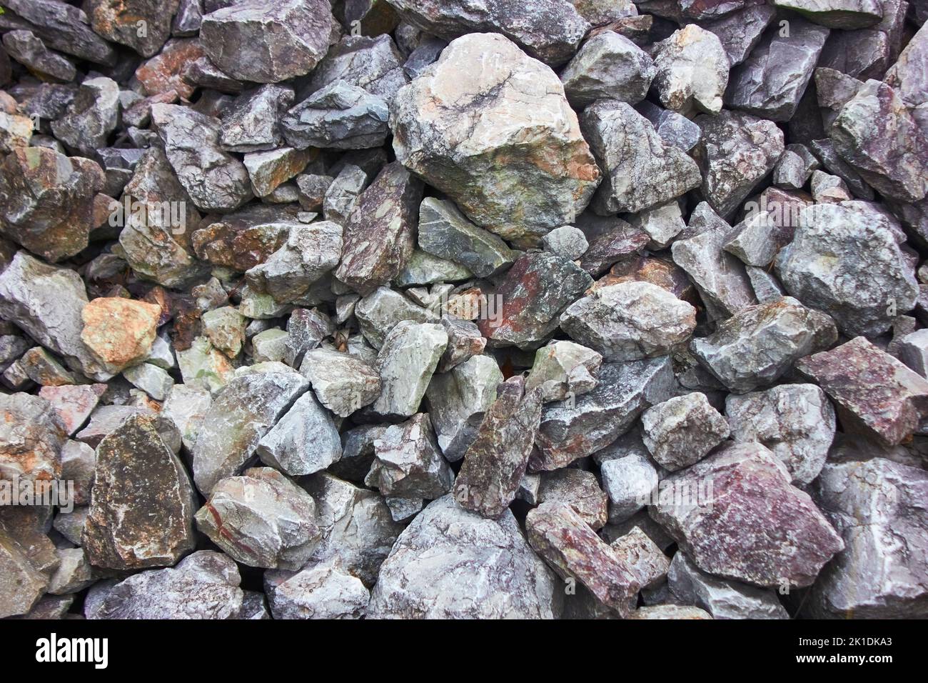Crushed close up different stone texture background Stock Photo - Alamy