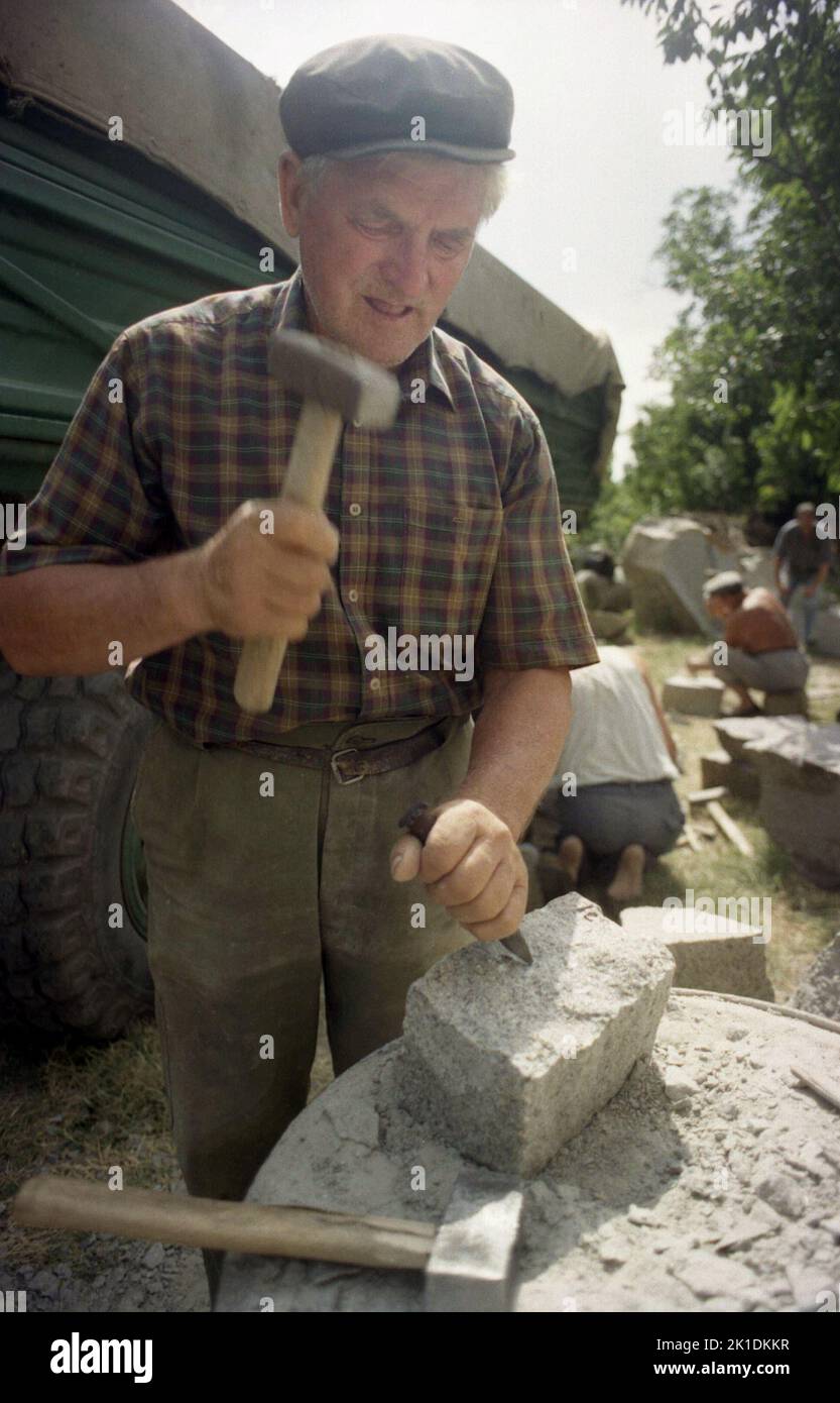 Greci, Tulcea County, Romania, 2000. A stone carver belonging to the ...