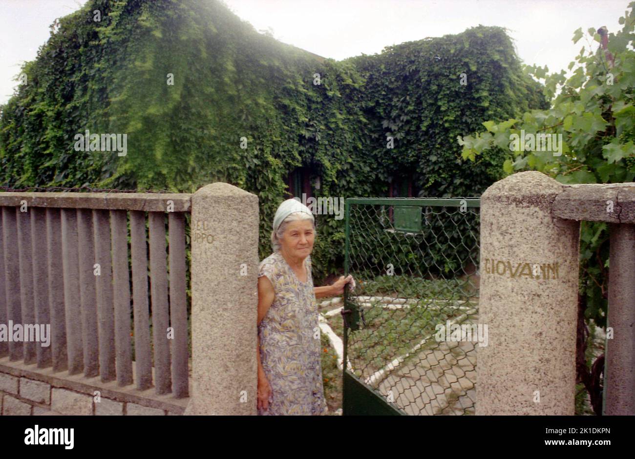 Greci, Tulcea County, Romania, 2000. Elderly woman from the small Italian community, with an ...