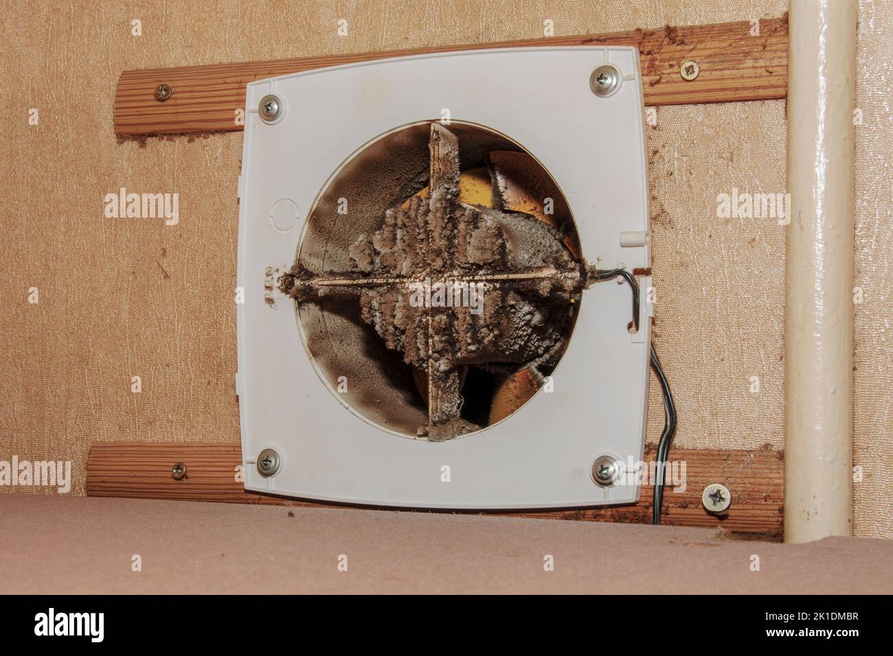 Close-up of a very dirty kitchen exhaust fan. Fan before preventive ...