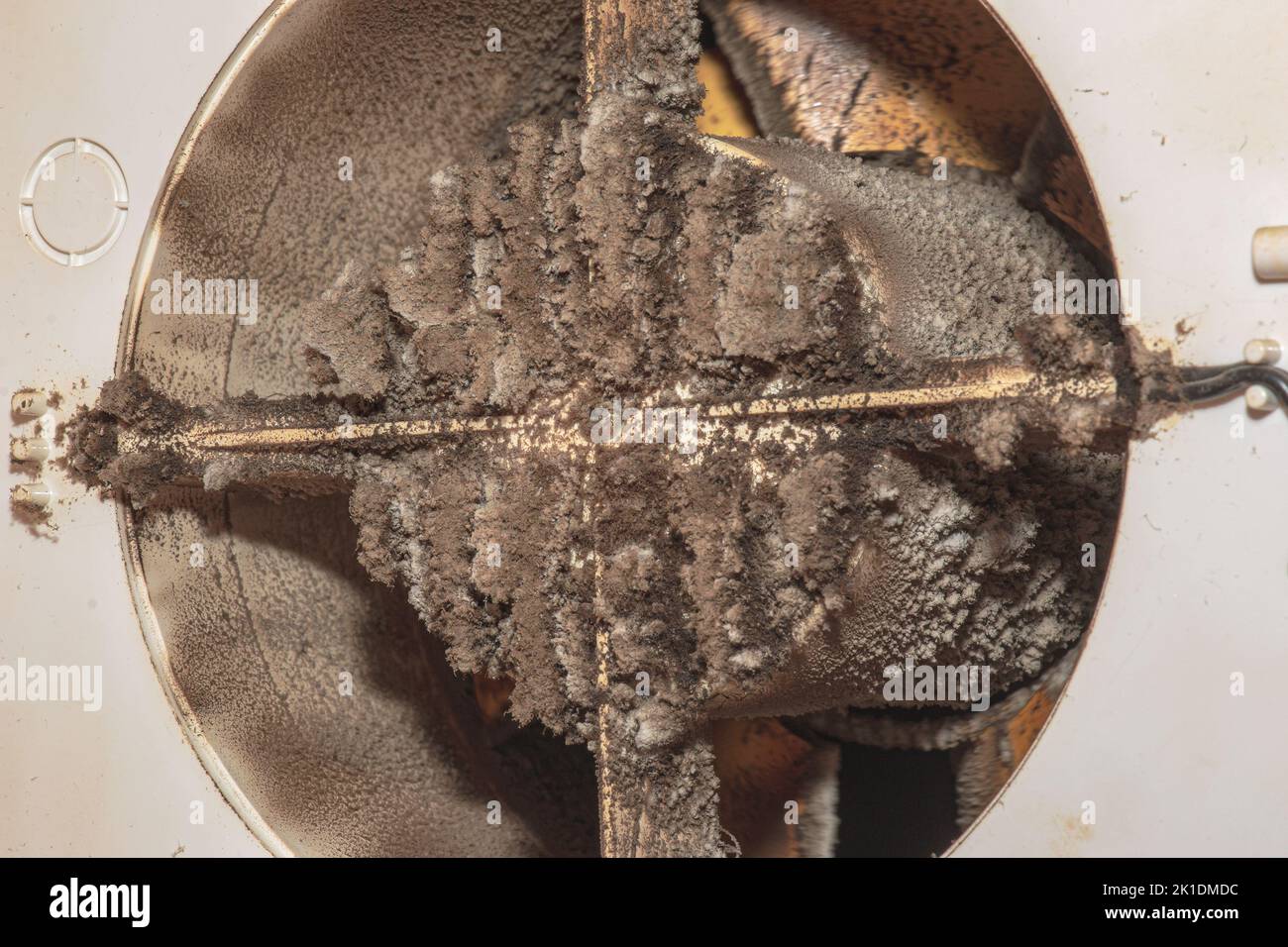 Close-up of a very dirty kitchen exhaust fan. Fan before preventive ...