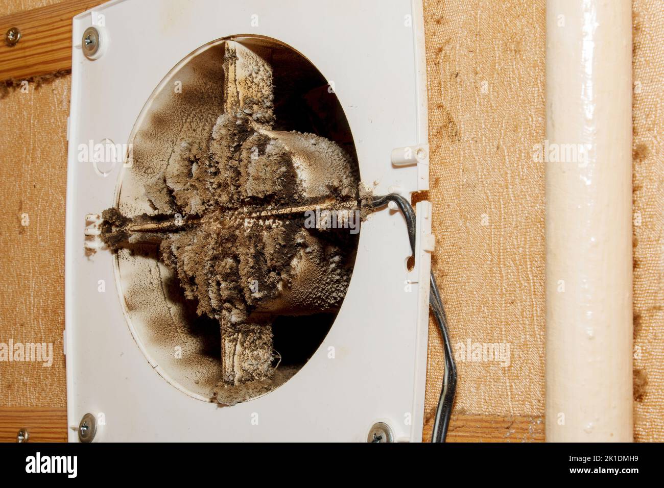 Close-up of a very dirty kitchen exhaust fan. Fan before preventive ...
