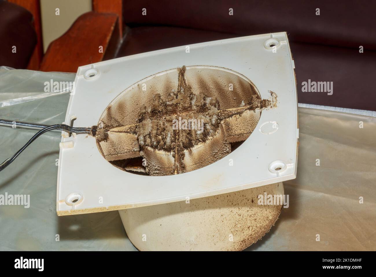 Close-up of a very dirty kitchen exhaust fan. Fan before preventive ...