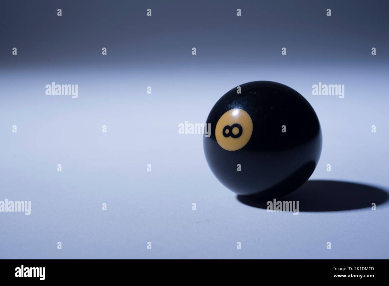 Eight ball symbol for success closeup on eightball with light ...