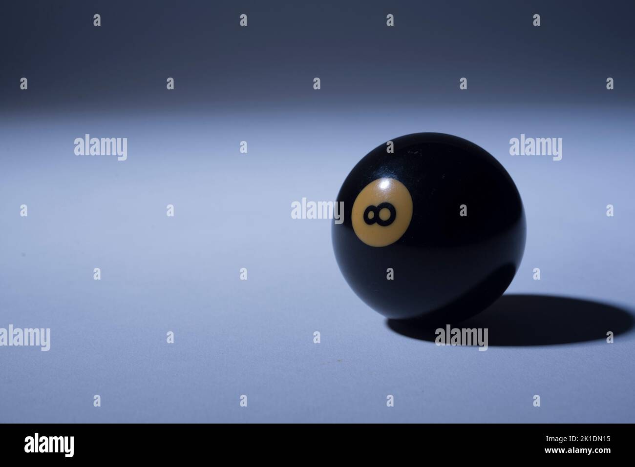 Eight ball symbol for success closeup on eightball with light ...