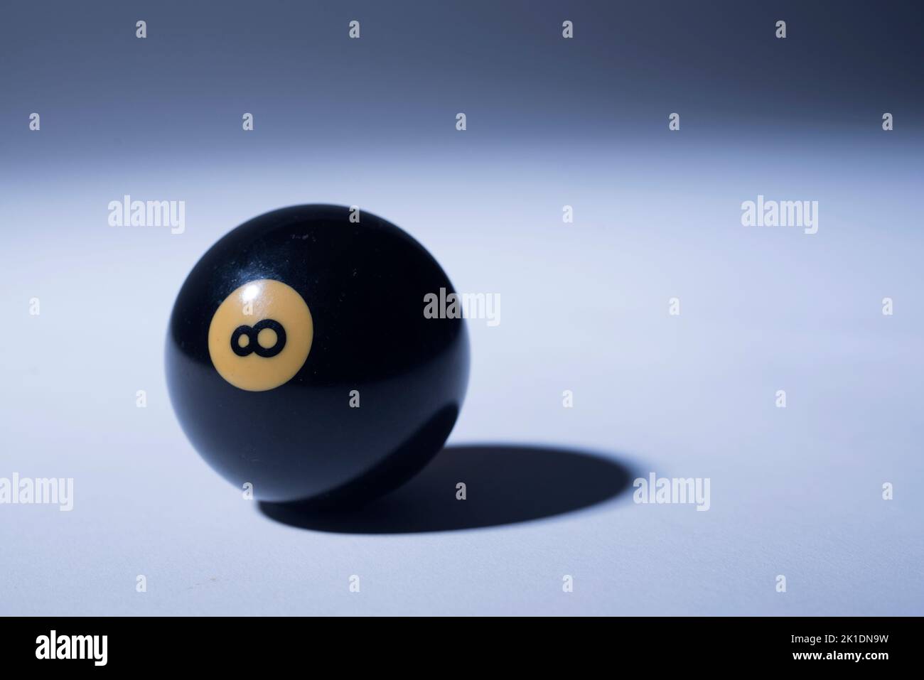 Eight ball symbol for success closeup on eightball with light ...