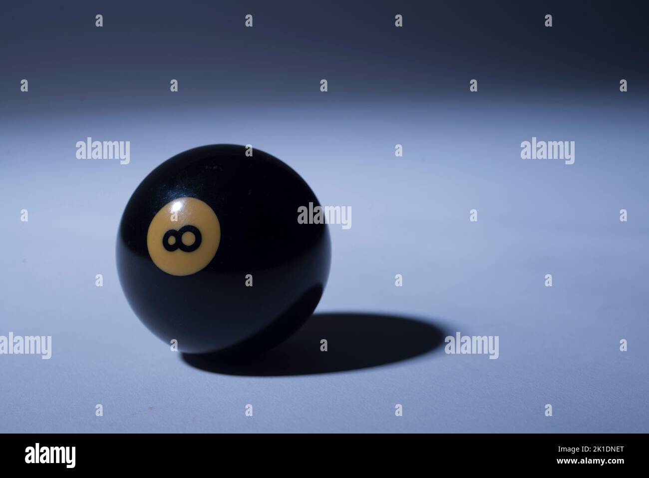 Eight ball symbol for success closeup on eightball with light ...