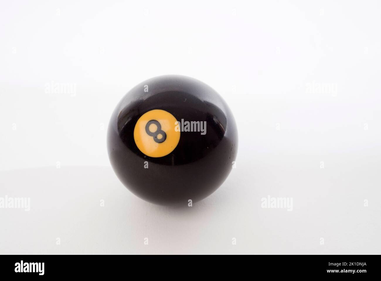 Eight ball symbol for success closeup on eightball with light ...