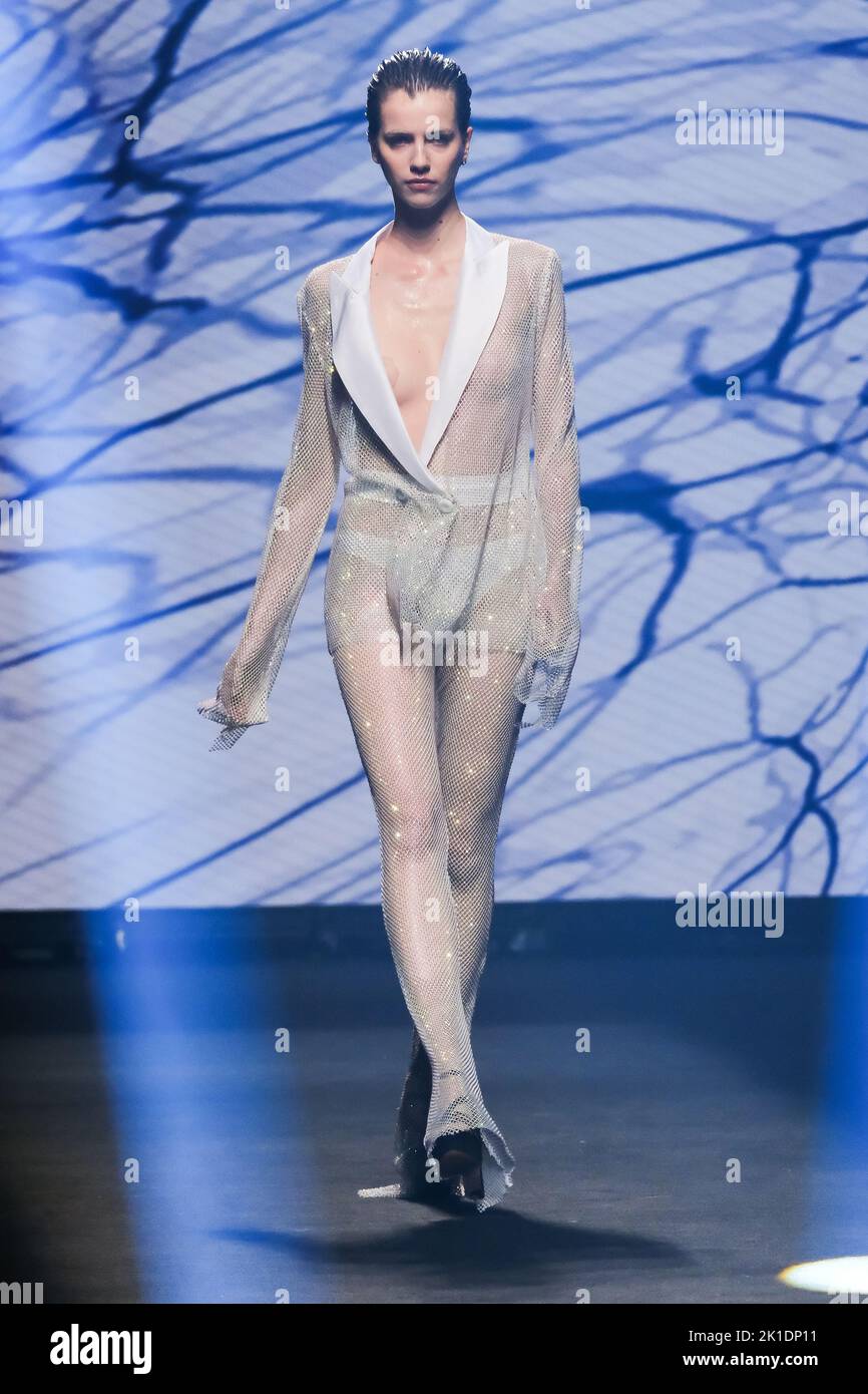 Madrid, Spain. 17th Sep, 2022. A model walks the runway wearing a ...