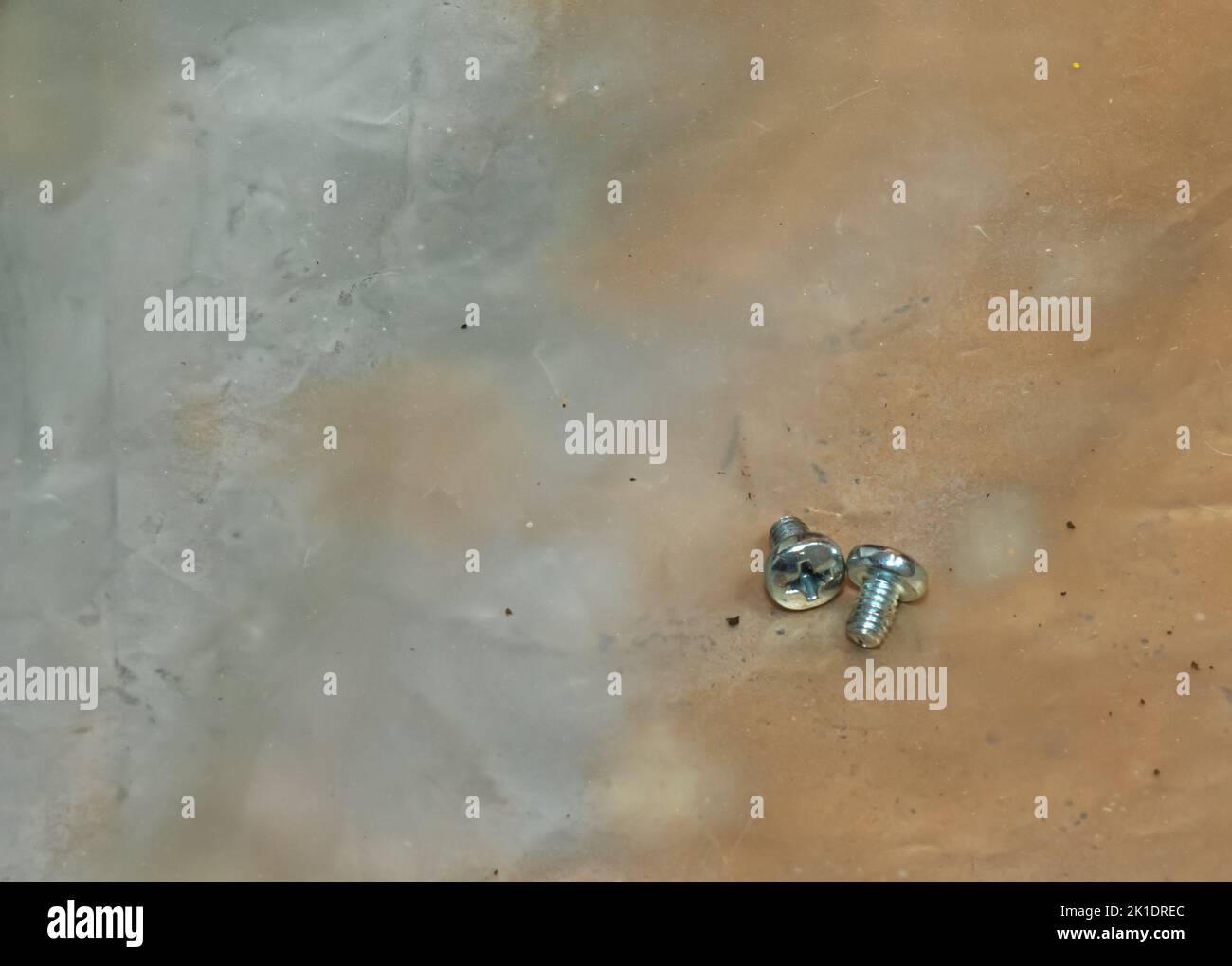 Two mounting bolts on the work surface. Close-up Stock Photo - Alamy