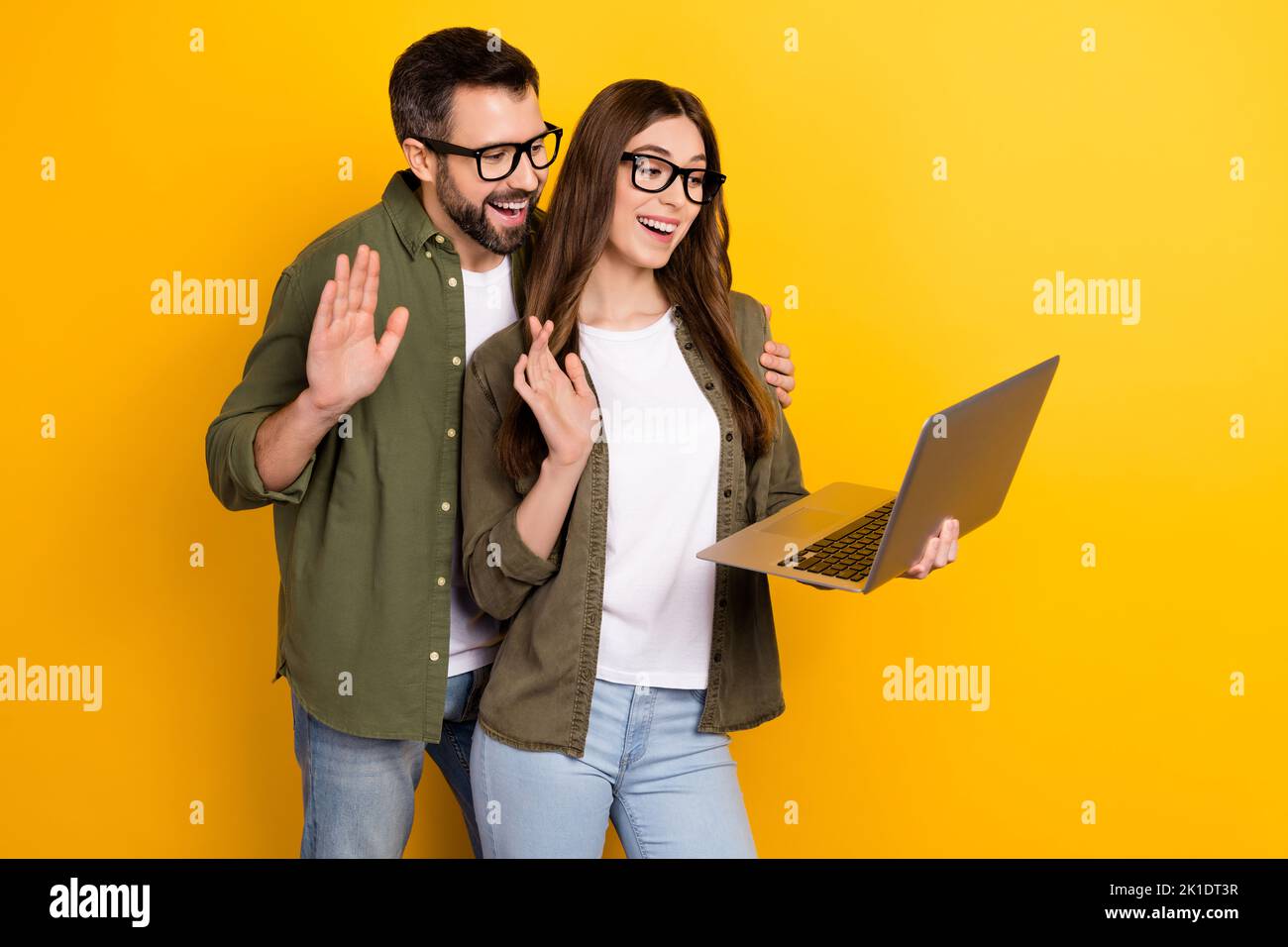 Photo of cheerful lovely couple have video call with family friends ...