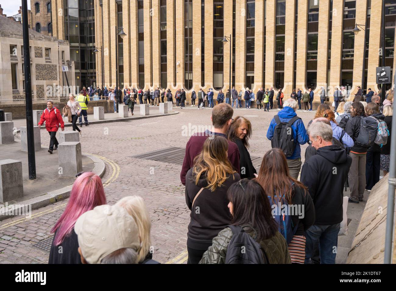 people joining the queues along the south bank of the River Thames to ...