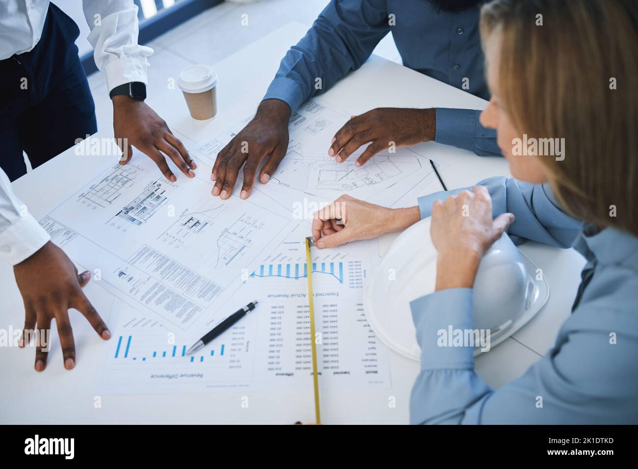 Collaboration, planning and hands of architect with blueprint documents ...