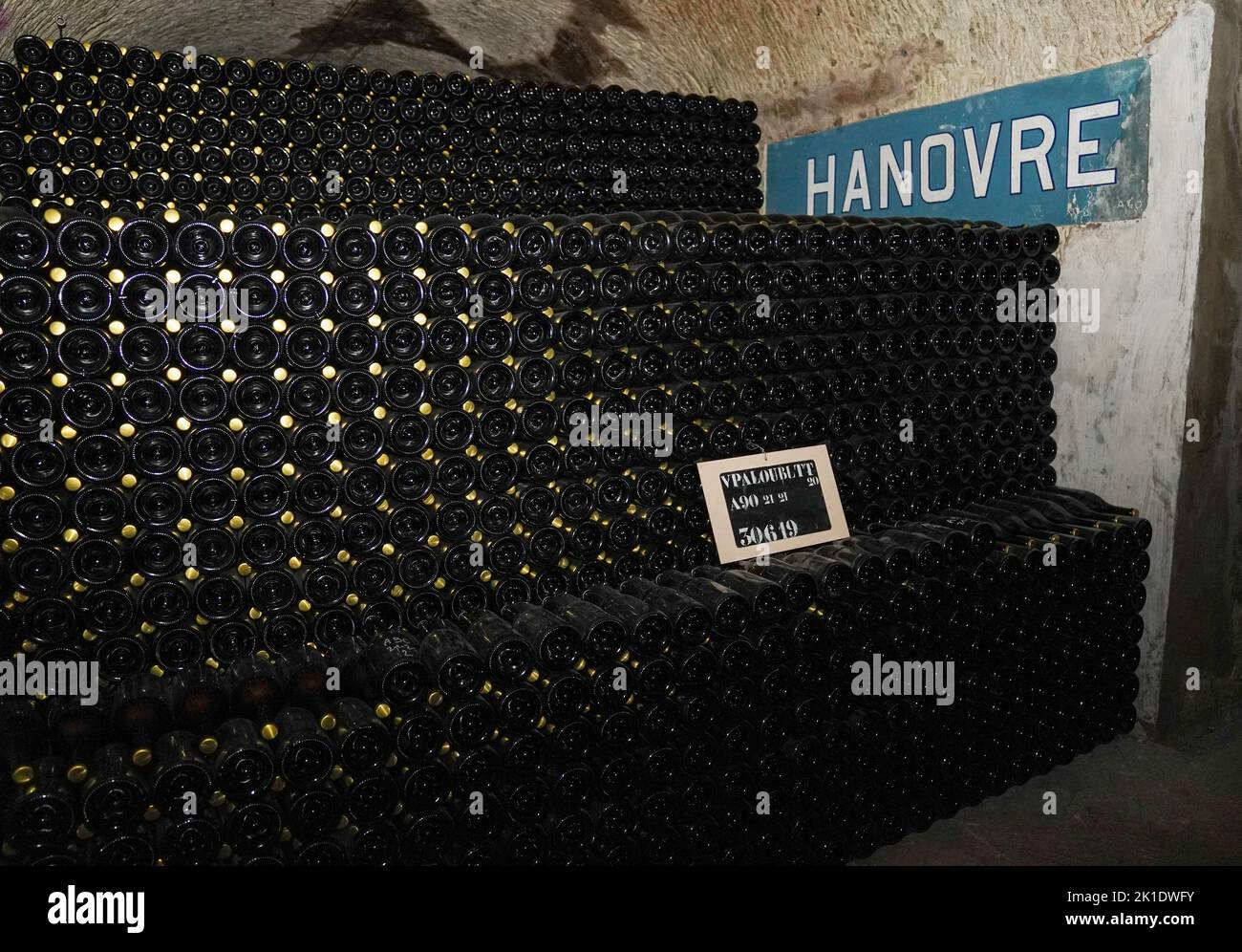 Champagne bottles in the gallery with the metropolis name at the cellar ...