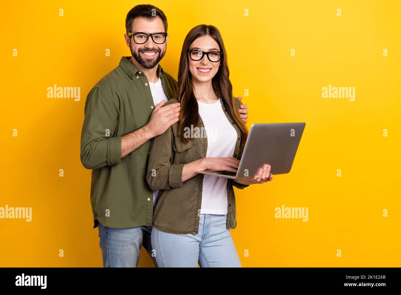 Portrait of attractive cheerful couple using laptop buy order service ...