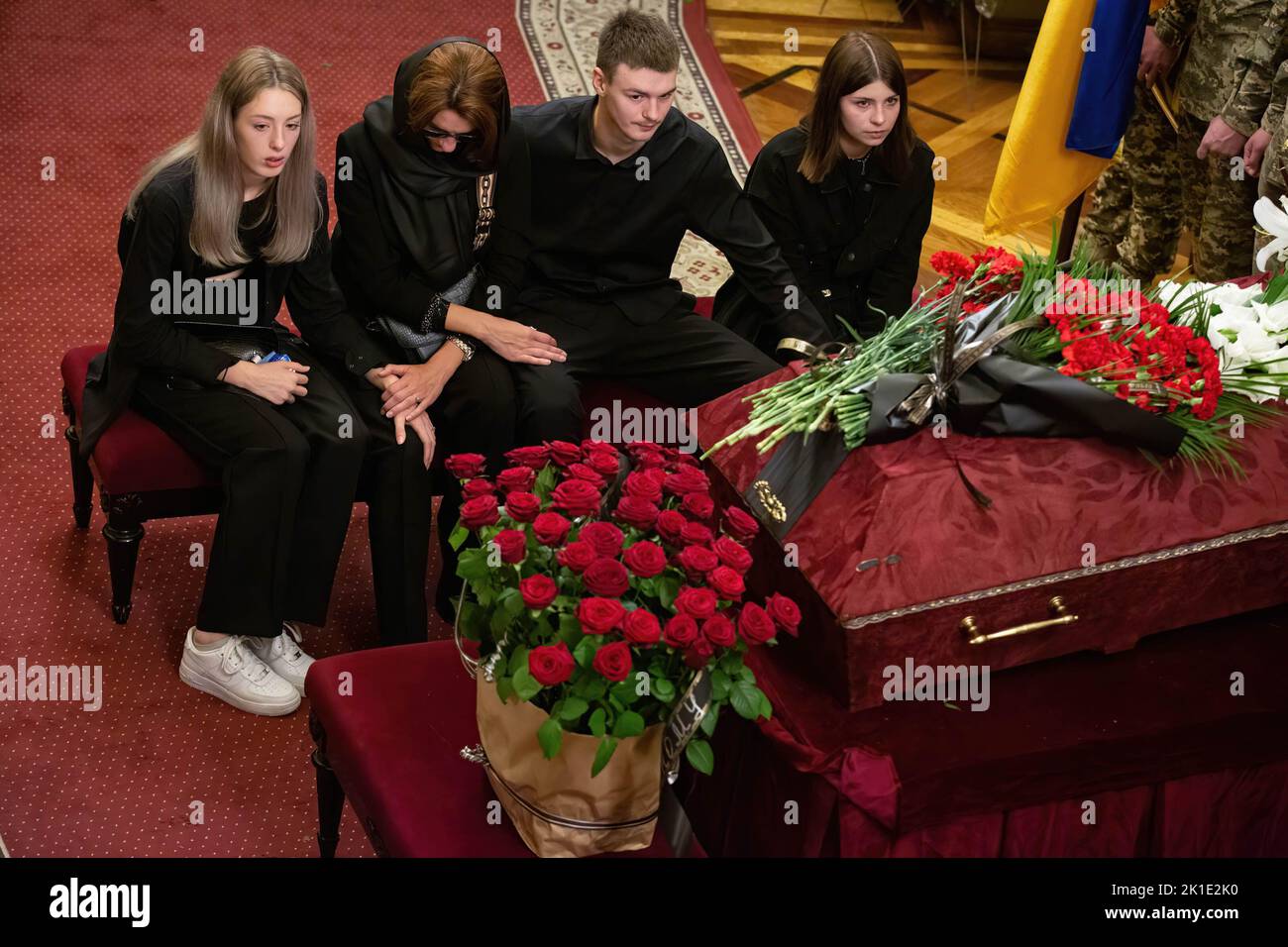 Relatives mourn near the coffin during a funeral ceremony for Ukrainian volunteer soldier and ...