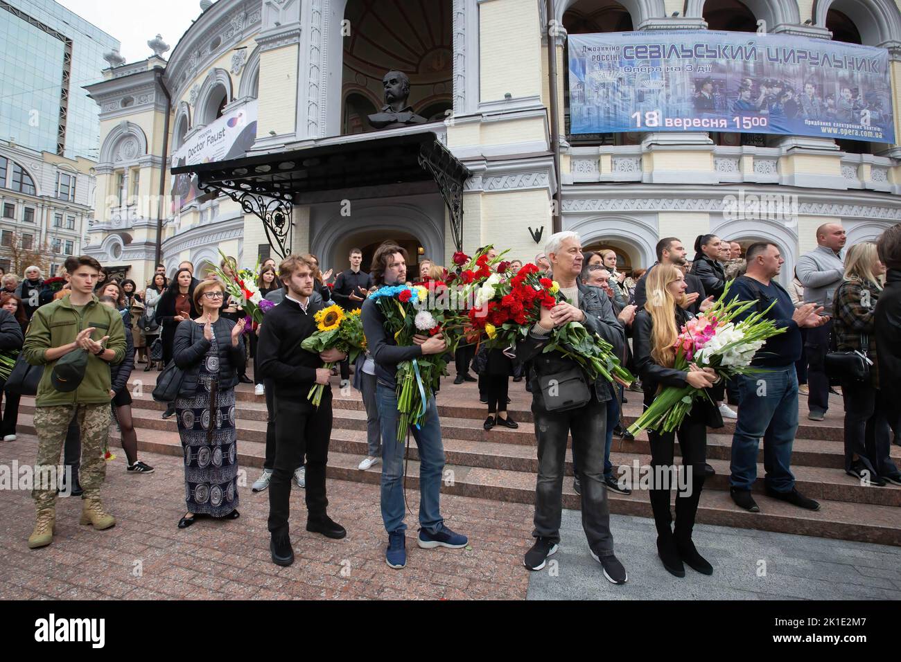 People attend a funeral ceremony for Ukrainian volunteer soldier and ...