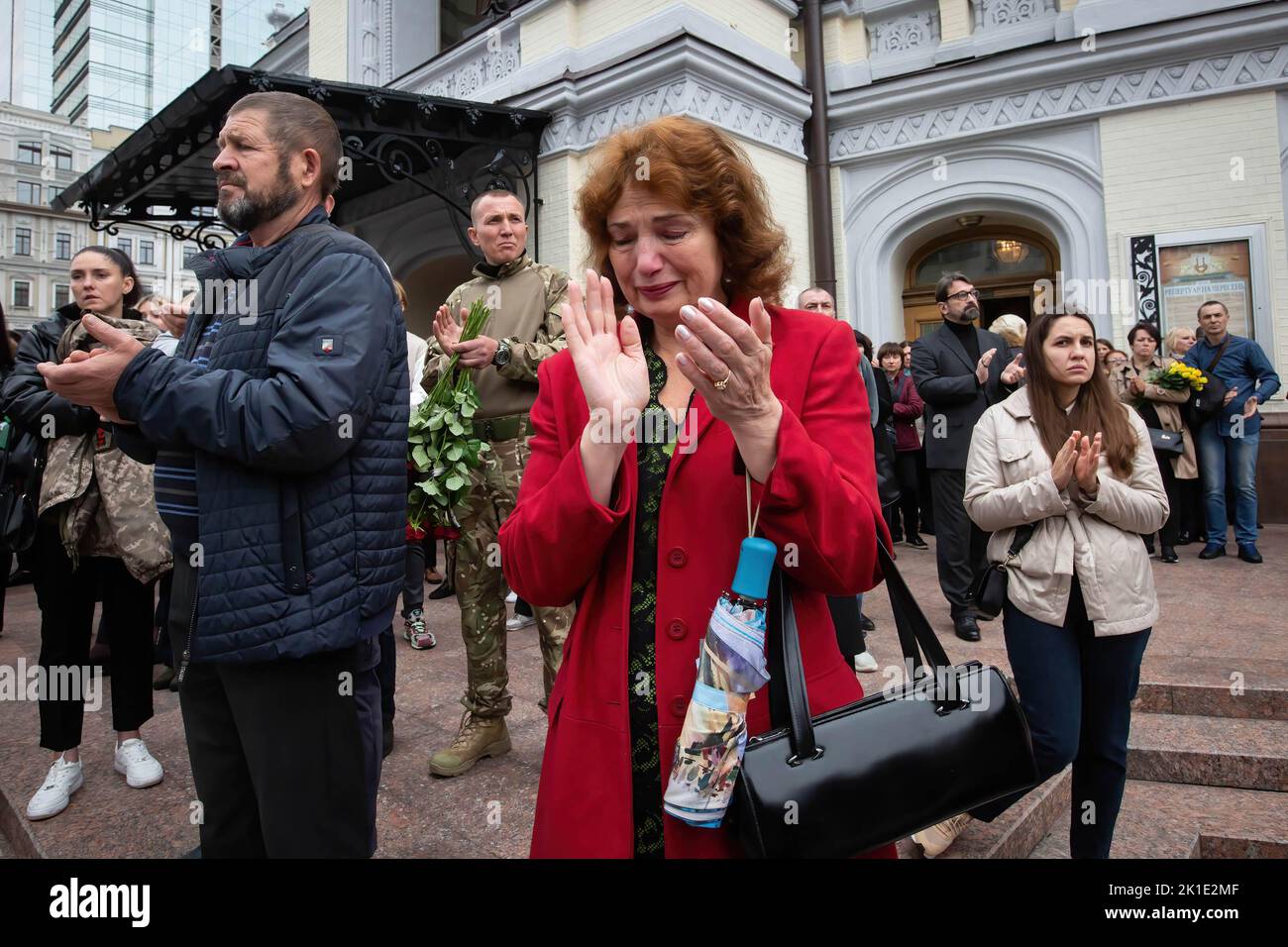 People applaud to pay their respects after the funeral ceremony of ...