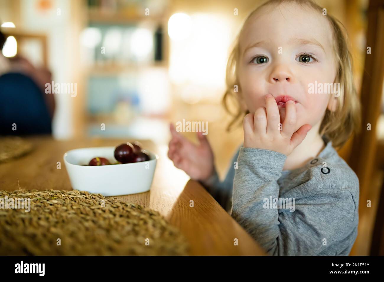 Cute little toddler boy eating grapes at home. Fresh organic frutis for ...