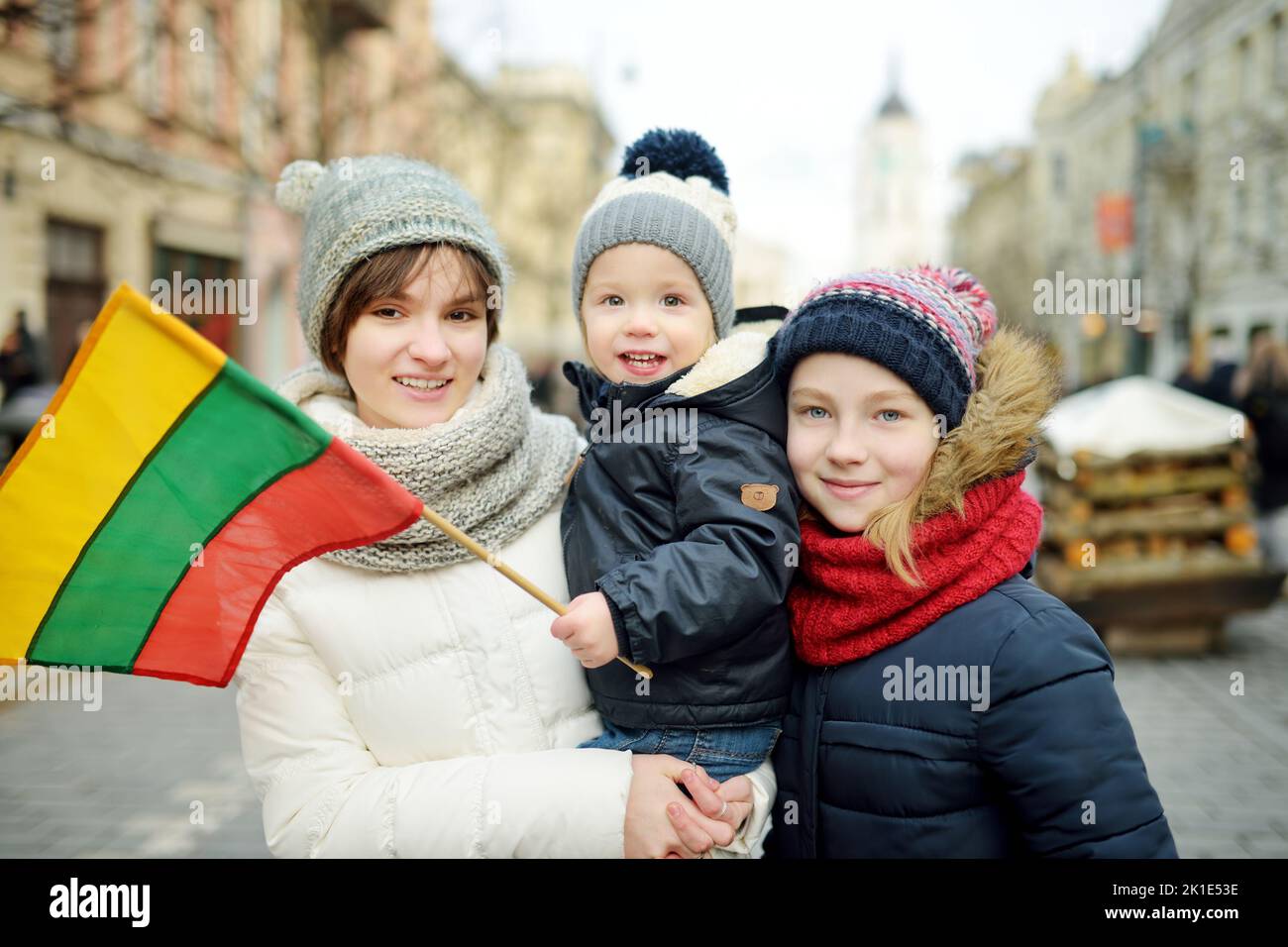 Two big sisters and their adorable toddler brother celebrating ...