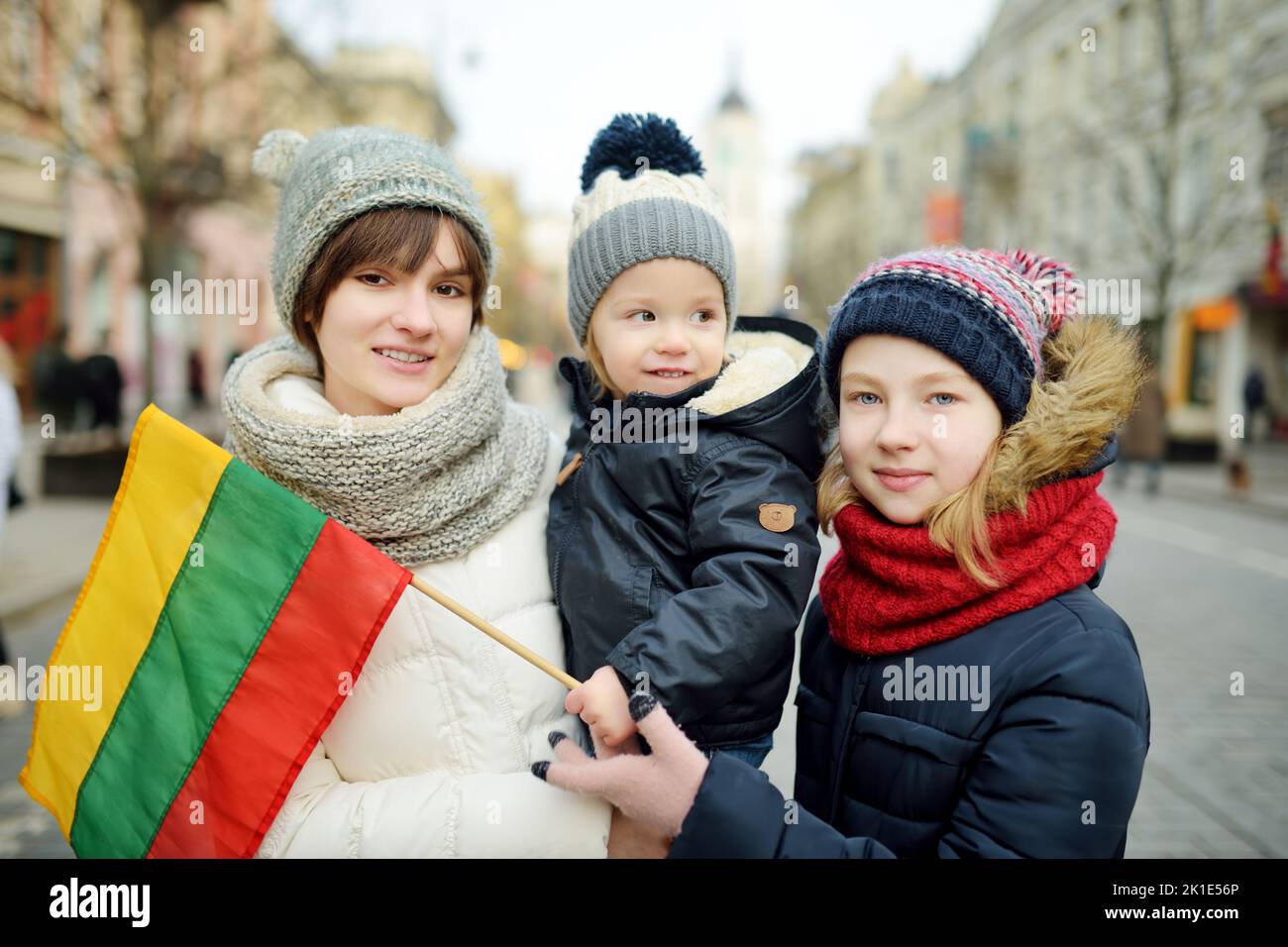 Two big sisters and their adorable toddler brother celebrating ...