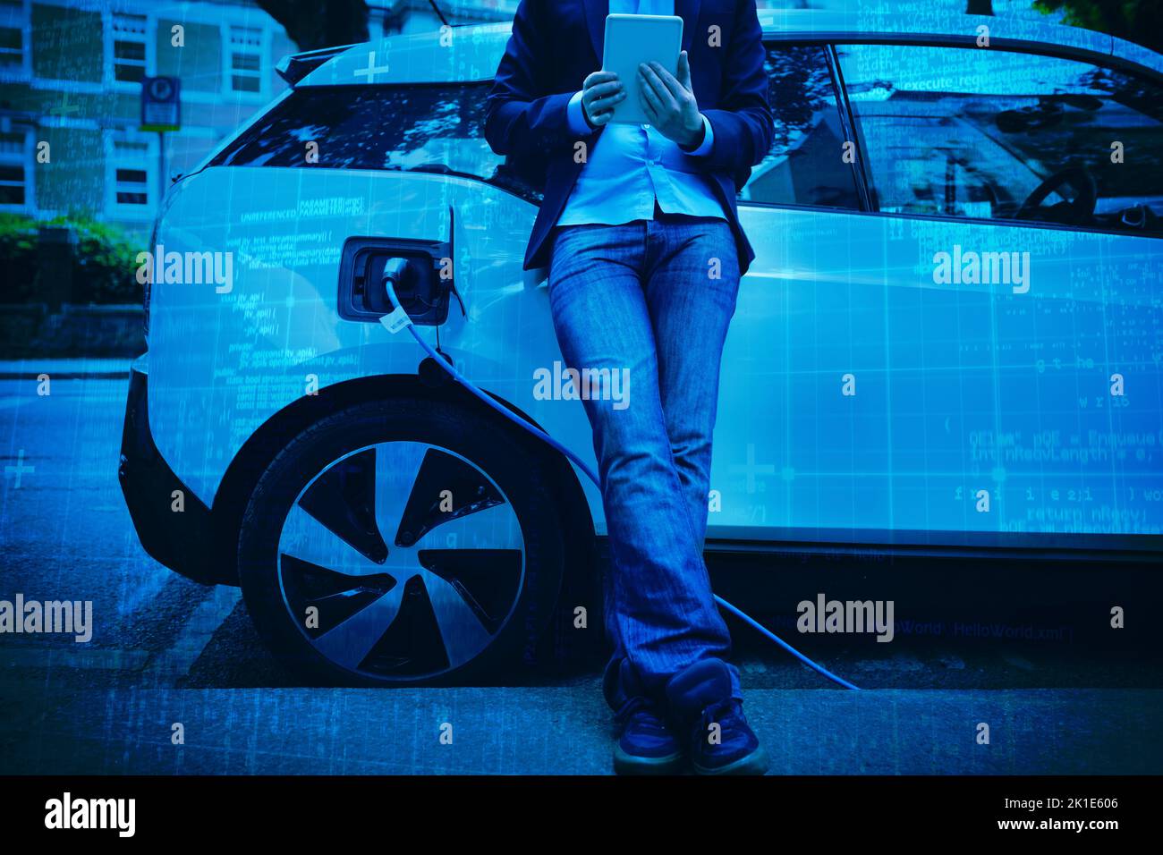 Blue matrix and codes against businessman using digital tablet while ...