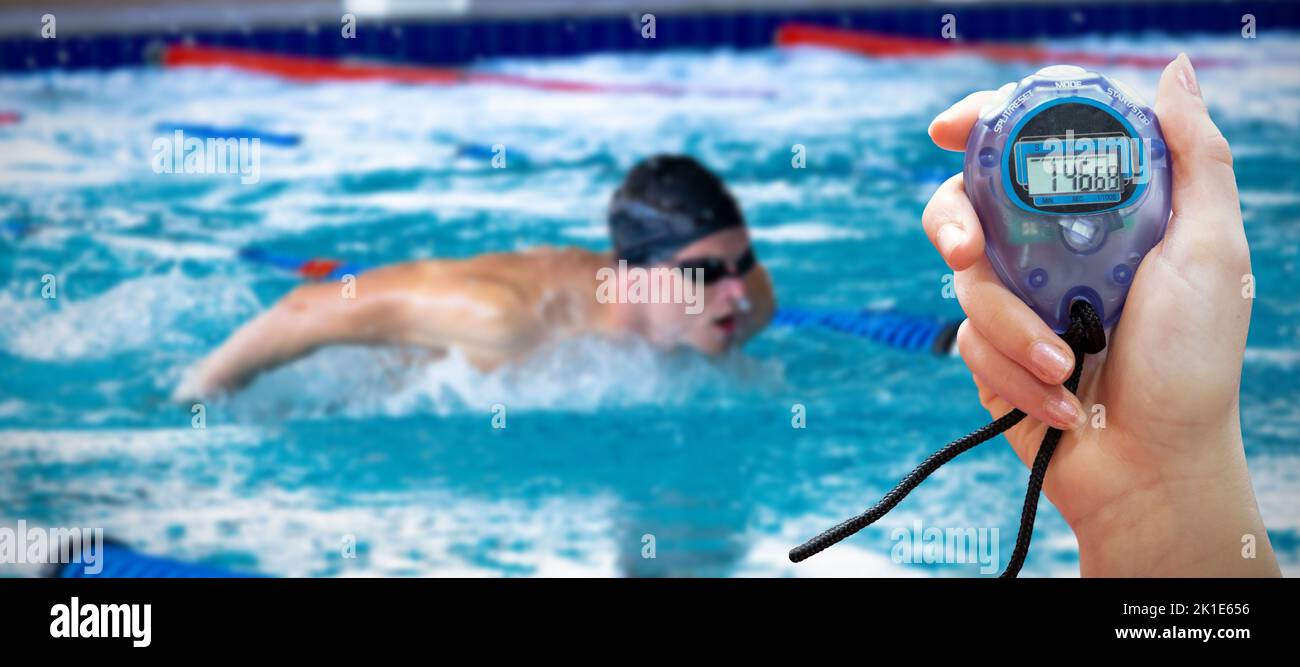 Close up of a hand holding a timer on a white background against ...