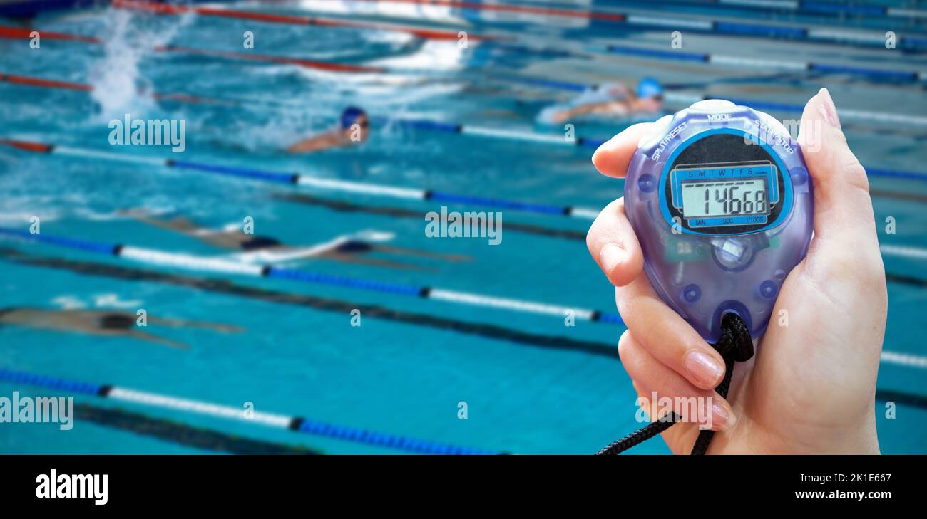 Close up of a hand holding a timer on a white background against ...