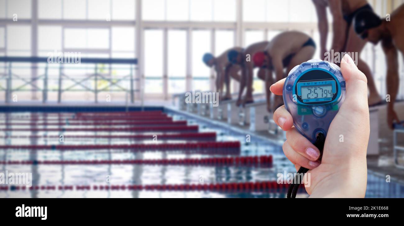 Close-up of a woman holding a chronometer to measure performance ...