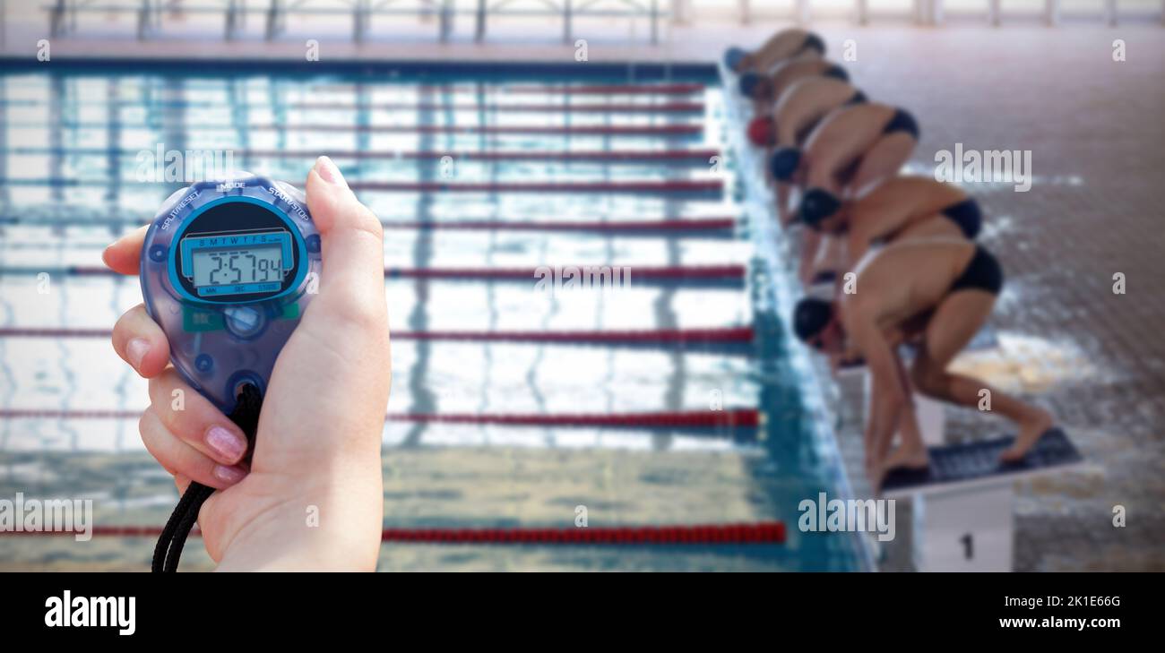 Close-up of a woman holding a chronometer to measure performance ...