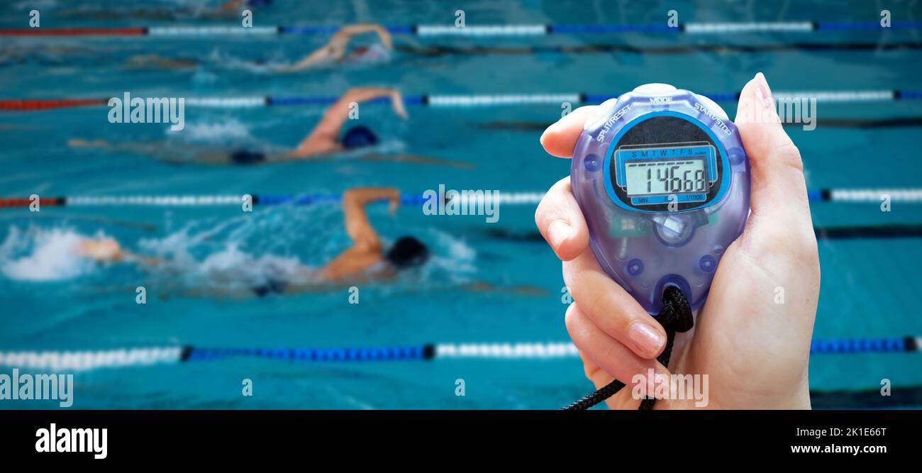 Close up of a hand holding a timer on a white background against ...
