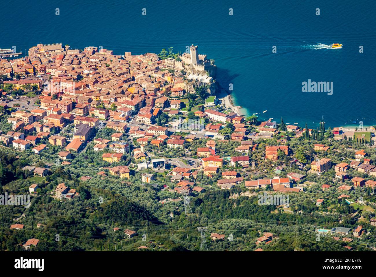 Idyllic Lake Garda above Malcesine old town with boat, Italian alps ...