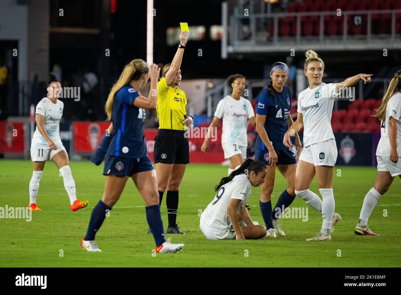 Match referee Shawn Tehini gives a yellow card to Spirit forward Ashley ...