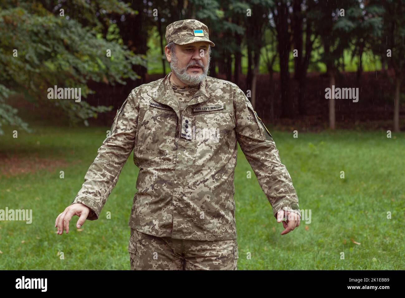 Portrait of a Ukrainian soldier in the forest. War in Ukraine, conflict ...